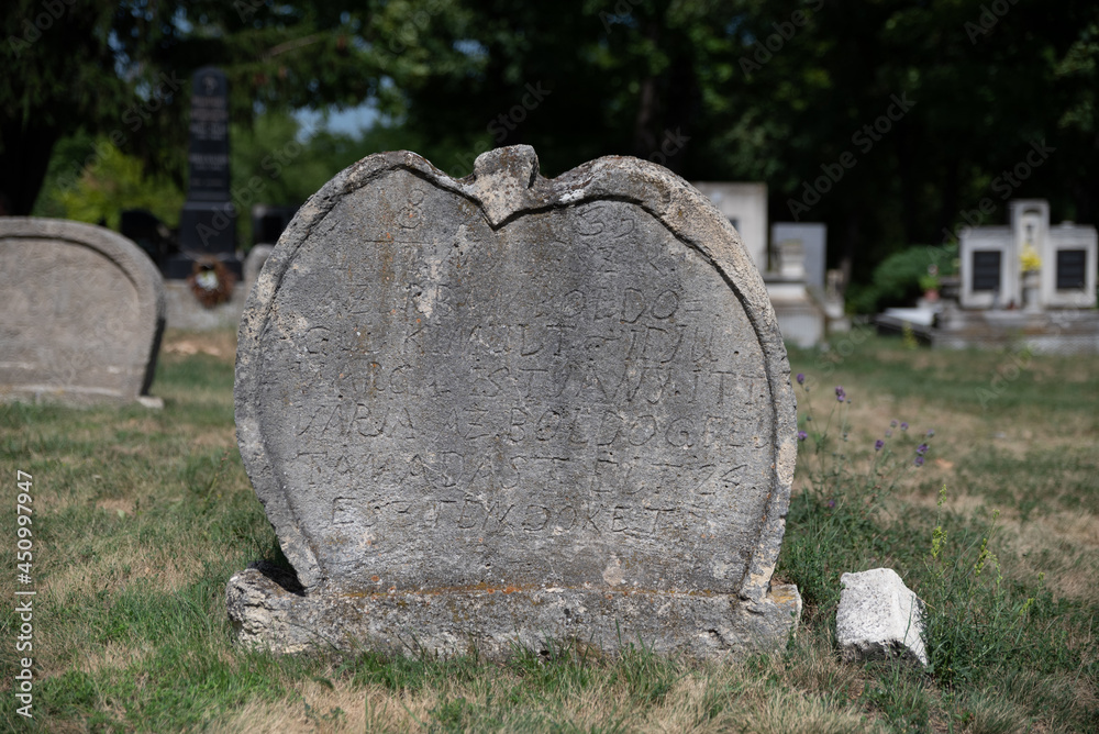 ancient old Tombstones in the cementery of Balatonudvari Hungary. The ...