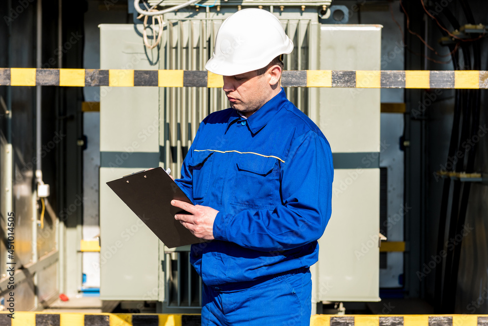 Execution of electrical measuring works on the power transformer Stock ...