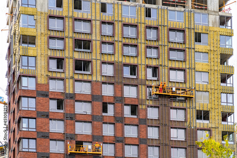 Monolithic concrete frame of apartment building under construction with ...