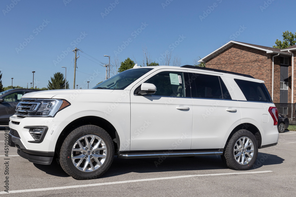 Ford Explorer display at a dealership. Ford offers the Explorer in a ...
