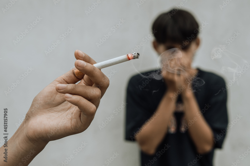 Woman smoking cigarette near people in public,smelling pollution ...