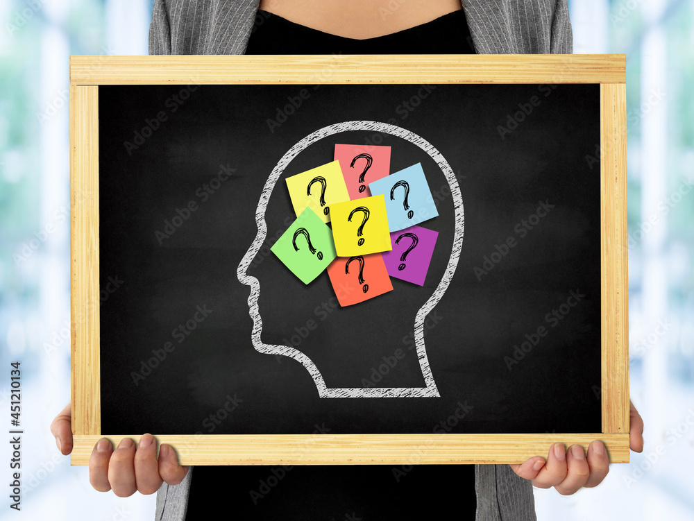Human brain with question mark concept, business woman hand holding a ...