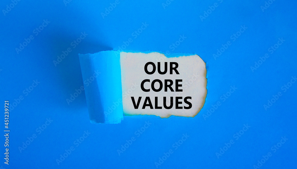 Our core values symbol. Words 'Our core values' appearing behind torn ...