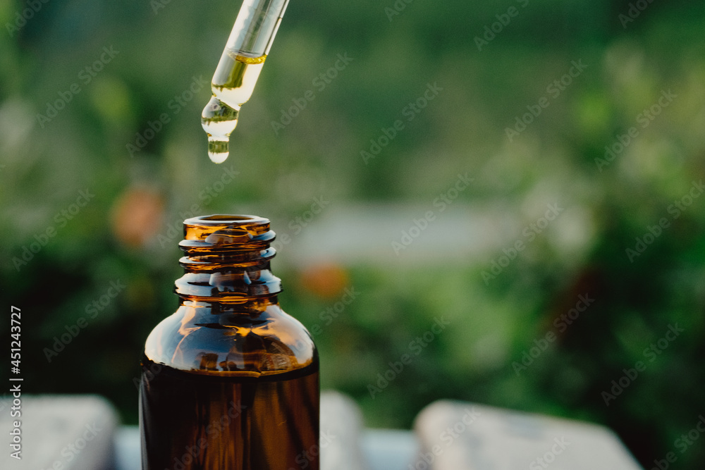 Pipette and bottle of essential oil. Eucalyptus essential oil dripping ...