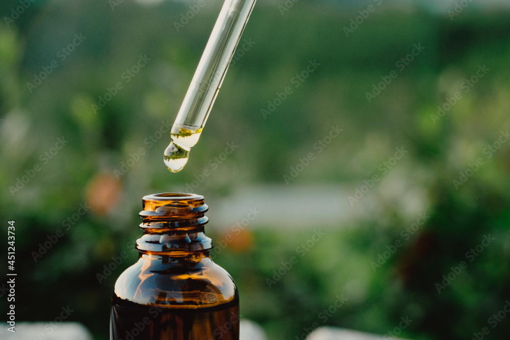 Pipette and bottle of essential oil. Eucalyptus essential oil dripping ...