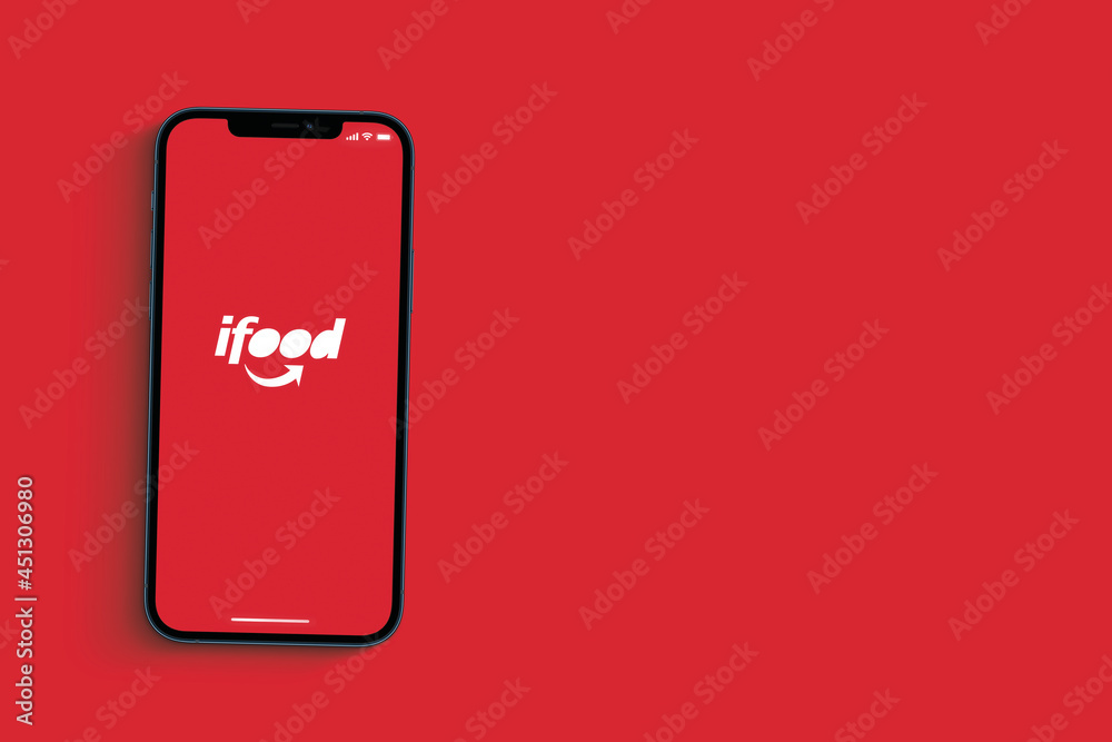 Ifood app on smartphone screen on red background. Ifood logo, digital ...