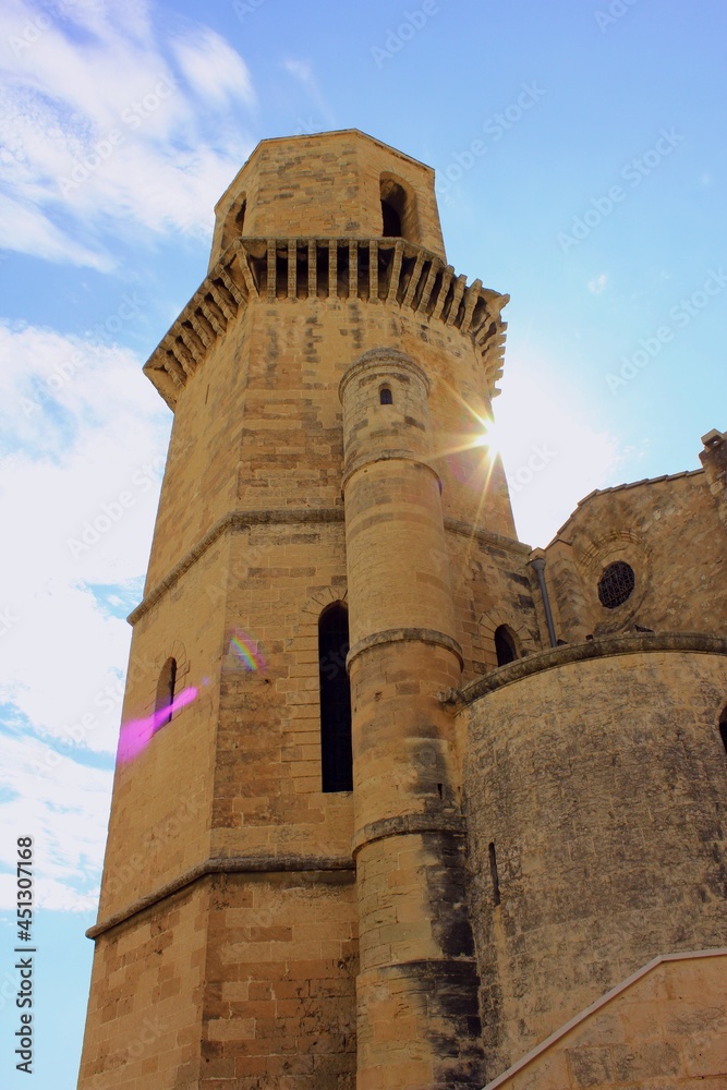 Rays of sun over the medieval castle or a fortress tower in Marseille ...