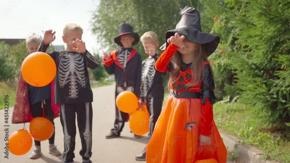Halloween kids. Jack-o-lantern. Children in carnival costumes outdoors ...