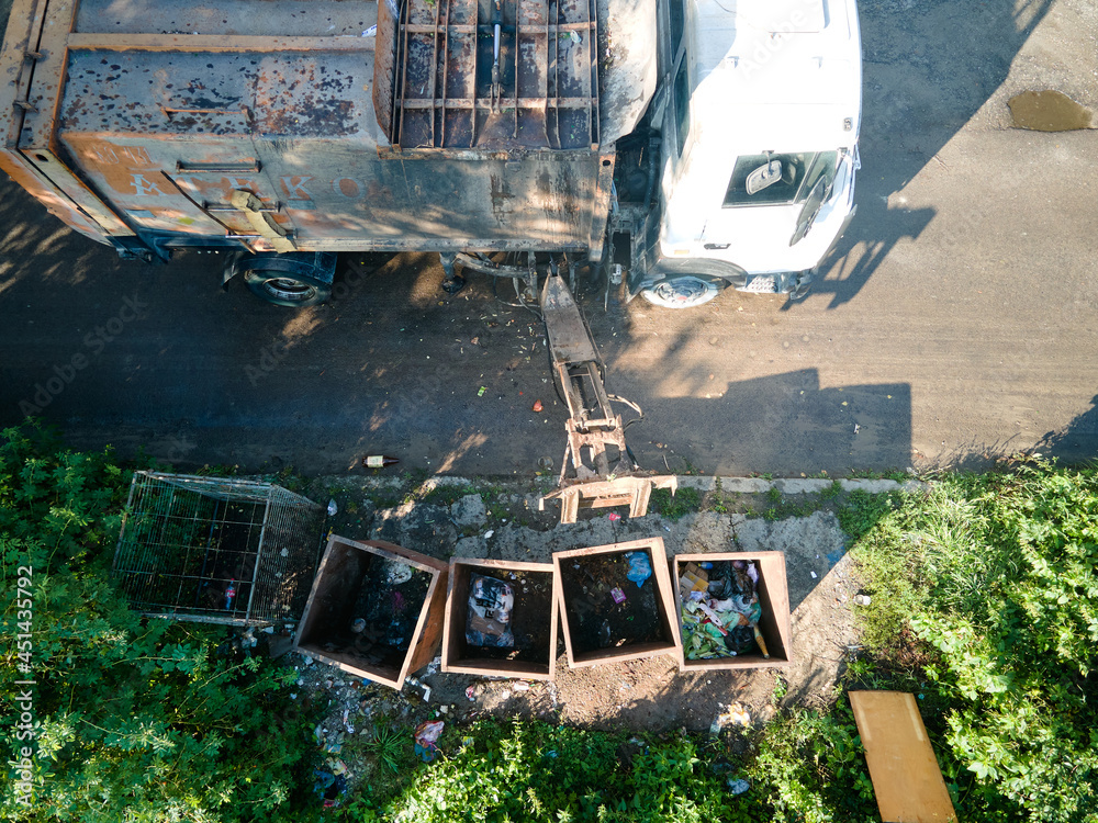 Municipal waste disposal. With a special car garbage truck, the garbage ...
