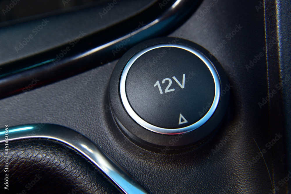 12V power outlet socket in the car Stock Photo | Adobe Stock