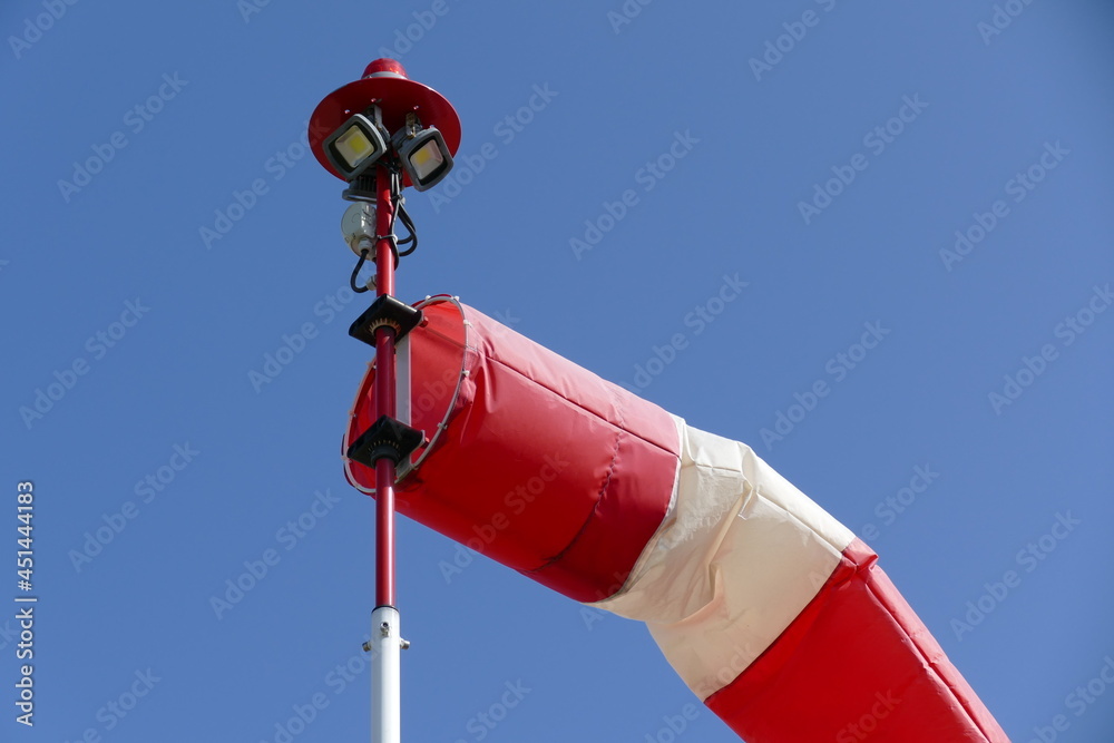 Air sock measuring the wind speed at stormy weather. Hurricane, tornado ...