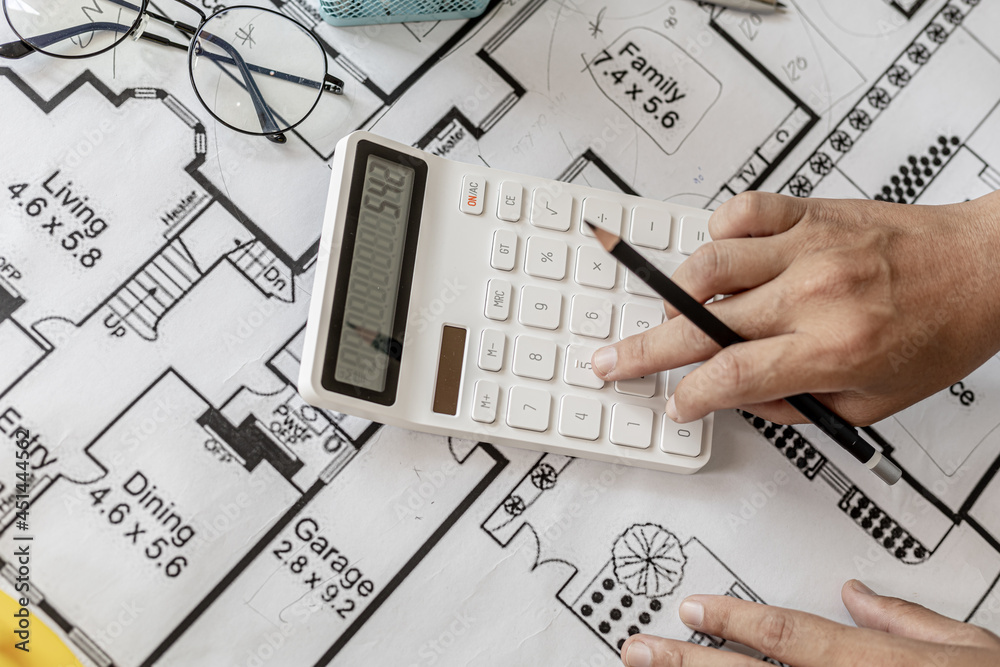 The architects pressed a calculator to calculate the area in a ...