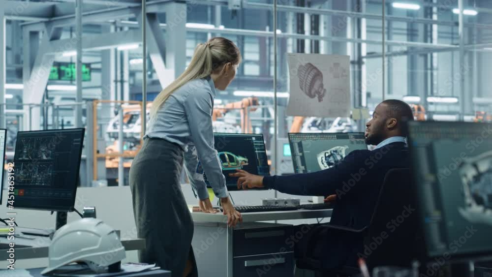 Car Factory Office: Project Manager Talks to Engineer Working on ...