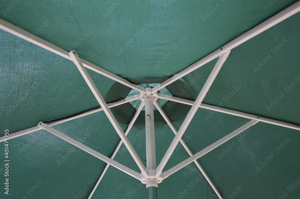 Inside structure of a large green umbrella Stock Photo | Adobe Stock