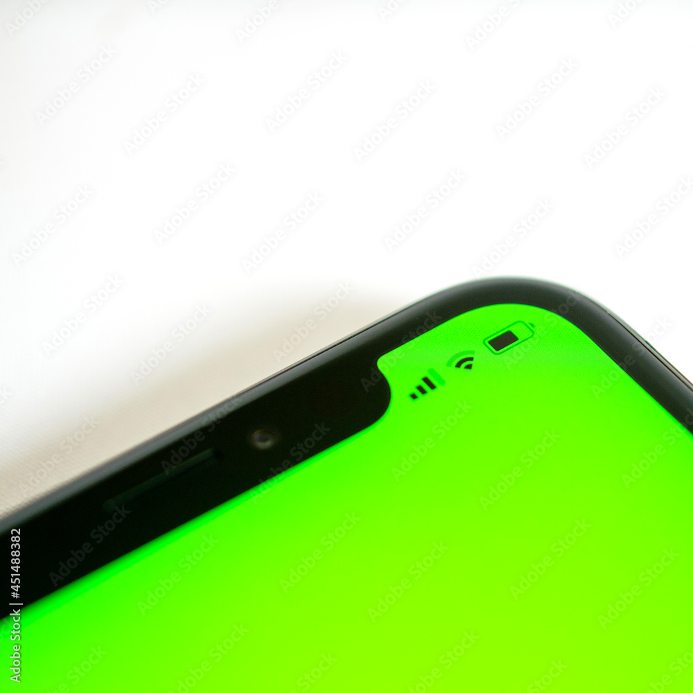 Smartphone detail with chroma green screen and icons for the current ...