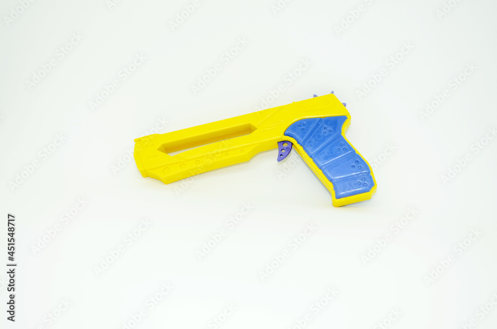 Yellow and blue toy gun isolated in white background Stock Photo ...