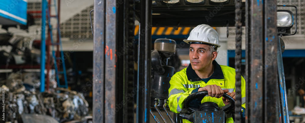 Man wear safety helmet happy smiling looking at camera driver forklift ...
