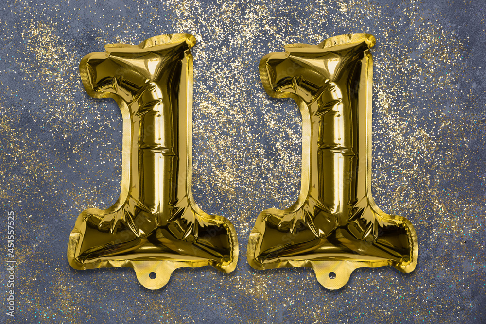 The number of the balloon made of golden foil, the number eleven on a ...