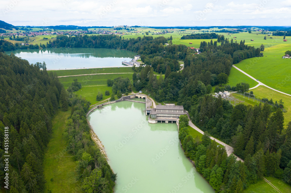 Panorama drone view over Forggensee lake. The largest power station is ...