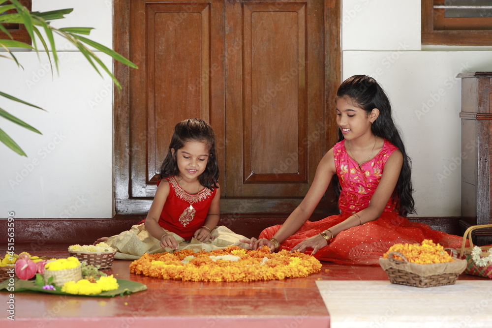 Onam pookalam making by kids Stock Photo | Adobe Stock