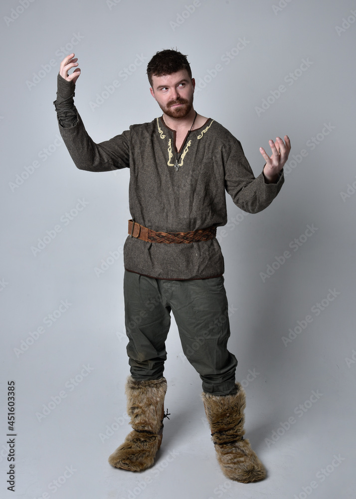 Full length portrait of young handsome man wearing medieval Celtic ...
