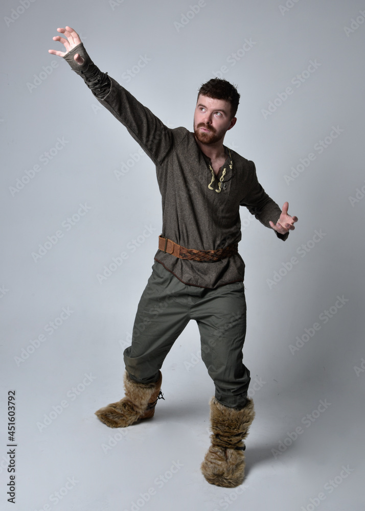 Full length portrait of young handsome man wearing medieval Celtic ...