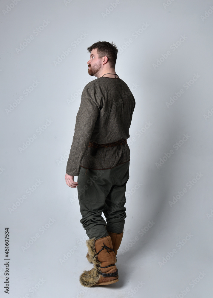 Full length portrait of young handsome man wearing medieval Celtic ...