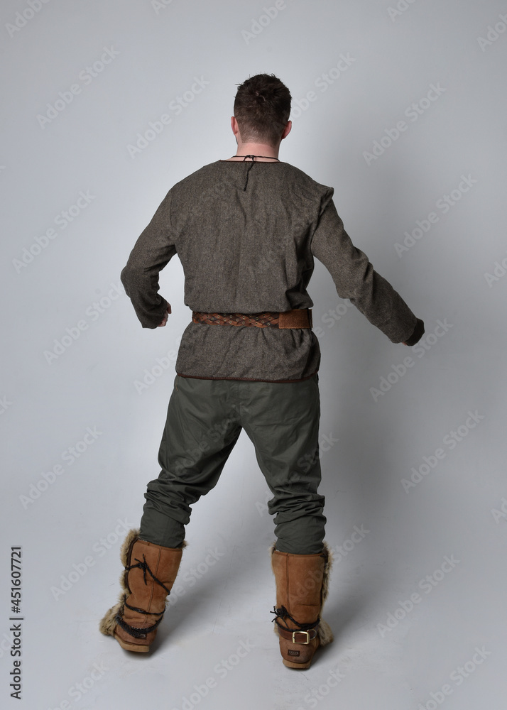 Full length portrait of young handsome man wearing medieval Celtic ...