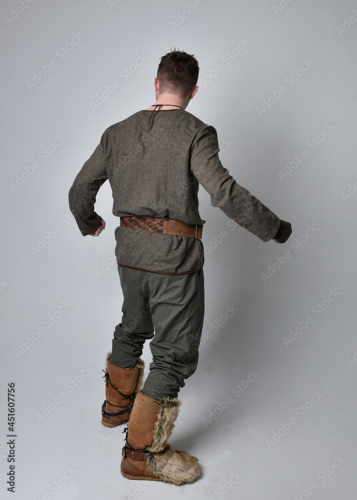 Full length portrait of young handsome man wearing medieval Celtic ...