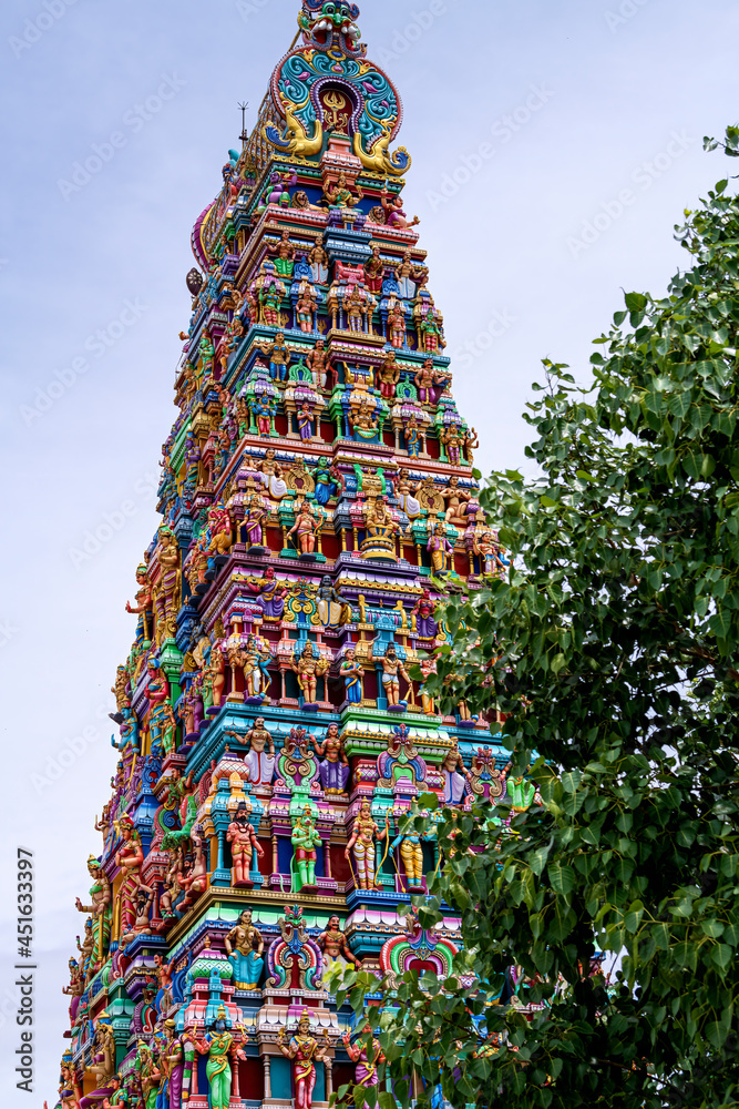 Temple tower in close up with full architecture details. Multi colour ...
