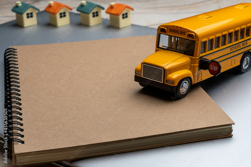 School bus on the Book. Composition school bus model and Note book ...