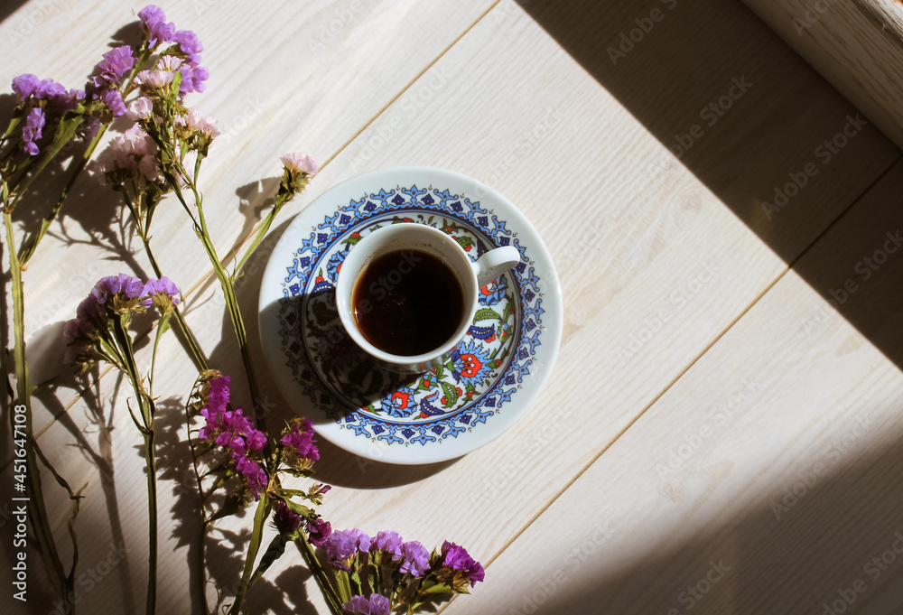 Turkish coffee in traditional blue porcelain cup at saucer on a white ...