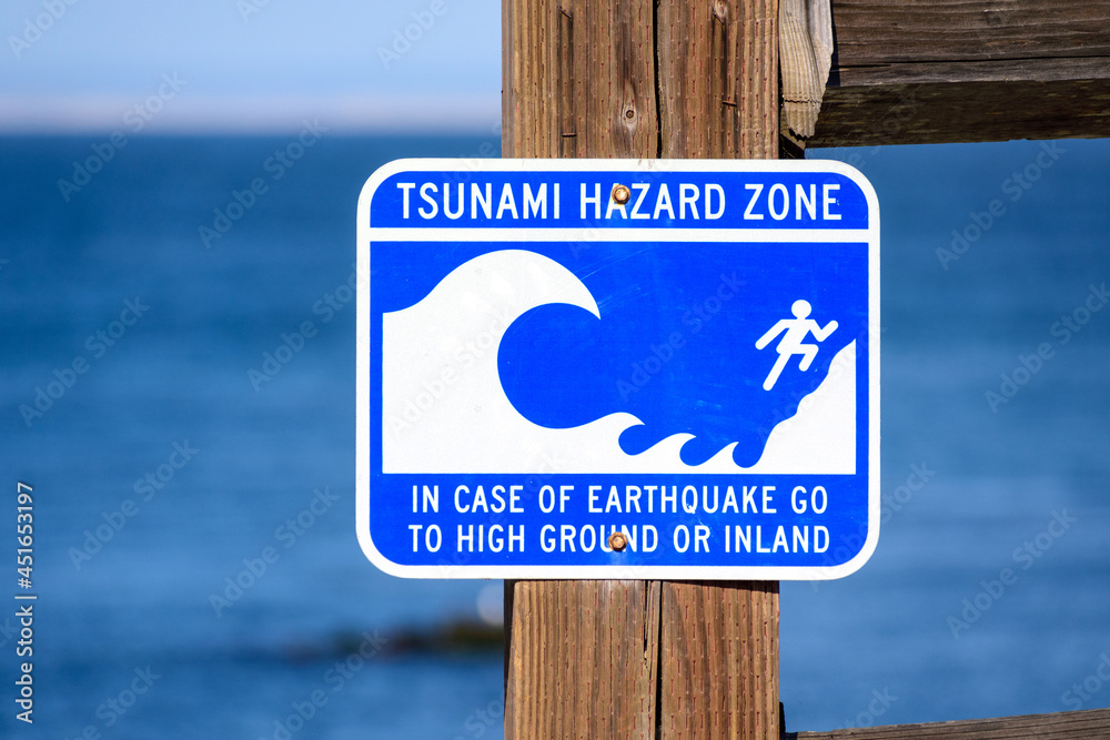 Tsunami Hazard Zone warning sign on ocean coast warn the public about ...