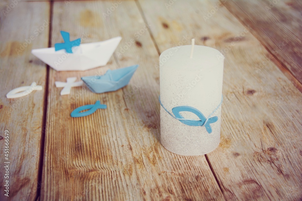 Candle with fish as a symbol for confirmation, communion, baptism ...