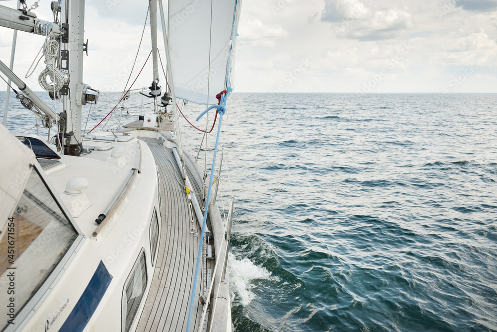 Herreshoff designed old classic yacht sailing in an open sea. Wooden ...