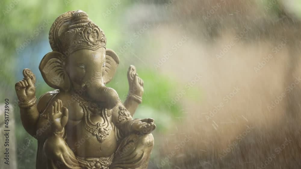 Water splash on lord ganesha sculpture. celebrate lord ganesha festival ...
