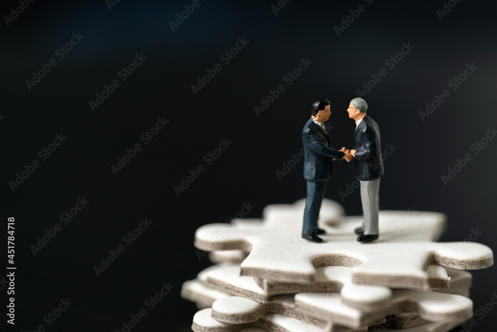 Miniature business man shake hand partner client customers on white ...