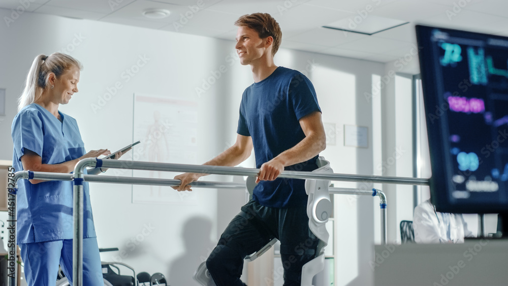 Modern Hospital Physical Therapy: Doctor Uses Tablet Computer, Helps ...