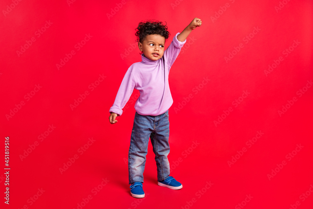 Full length body size view of attractive funny kid striving struggling ...