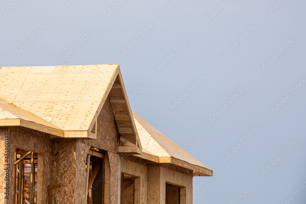 A residential frame house construction project showing the engineered ...