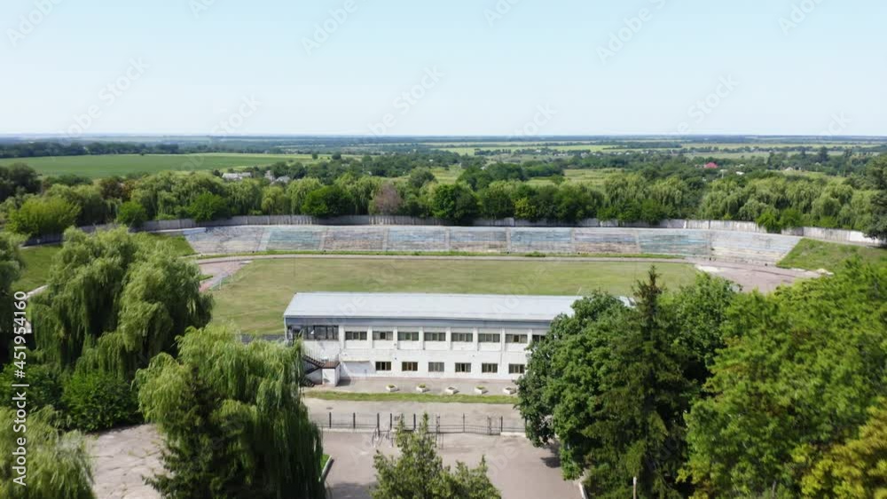 Abandoned derelict unbuilt stadium construction ruins in city, aerial ...