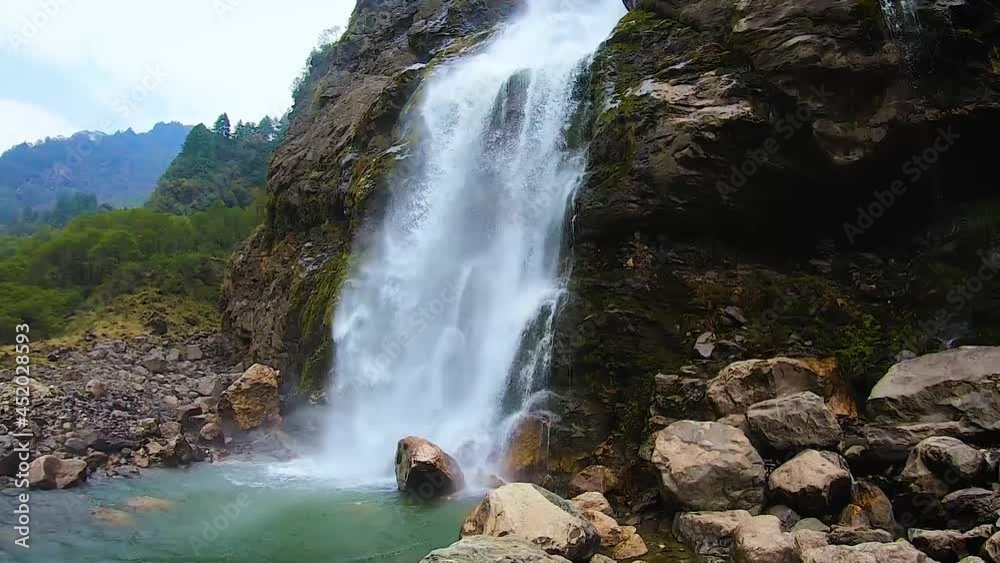 waterfall white water stream falling from mountains at day from flat ...