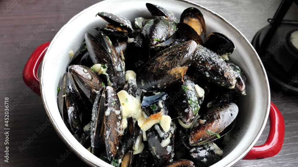 Cooper pot with fresh steamed mussels moules mariniere in white wine ...
