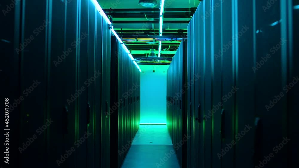 Camera moves through big working data center with server racks . Real ...