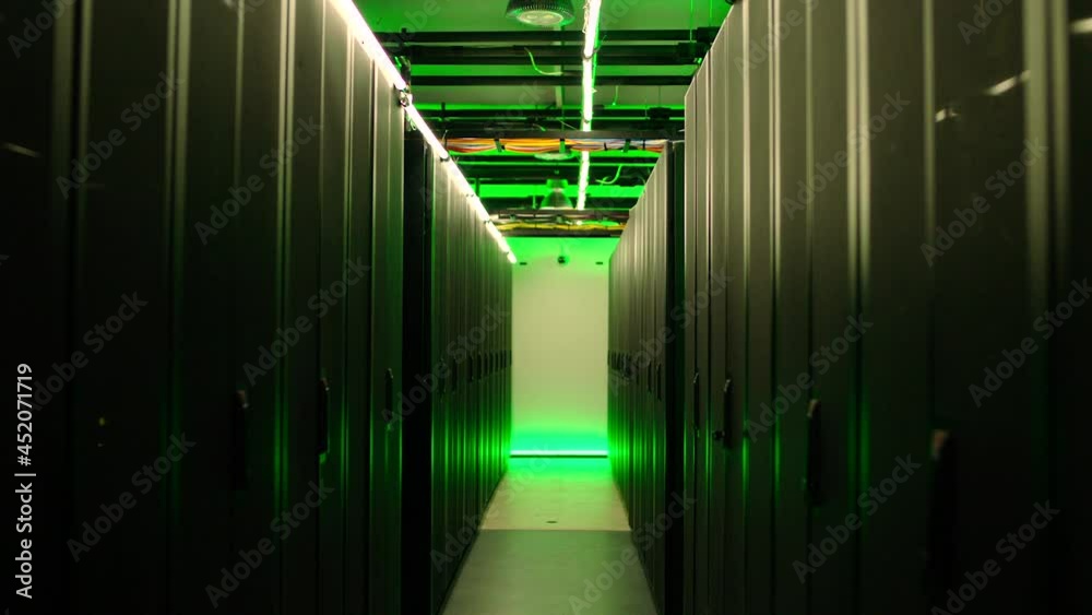 Camera moves through big working data center with server racks . Real ...