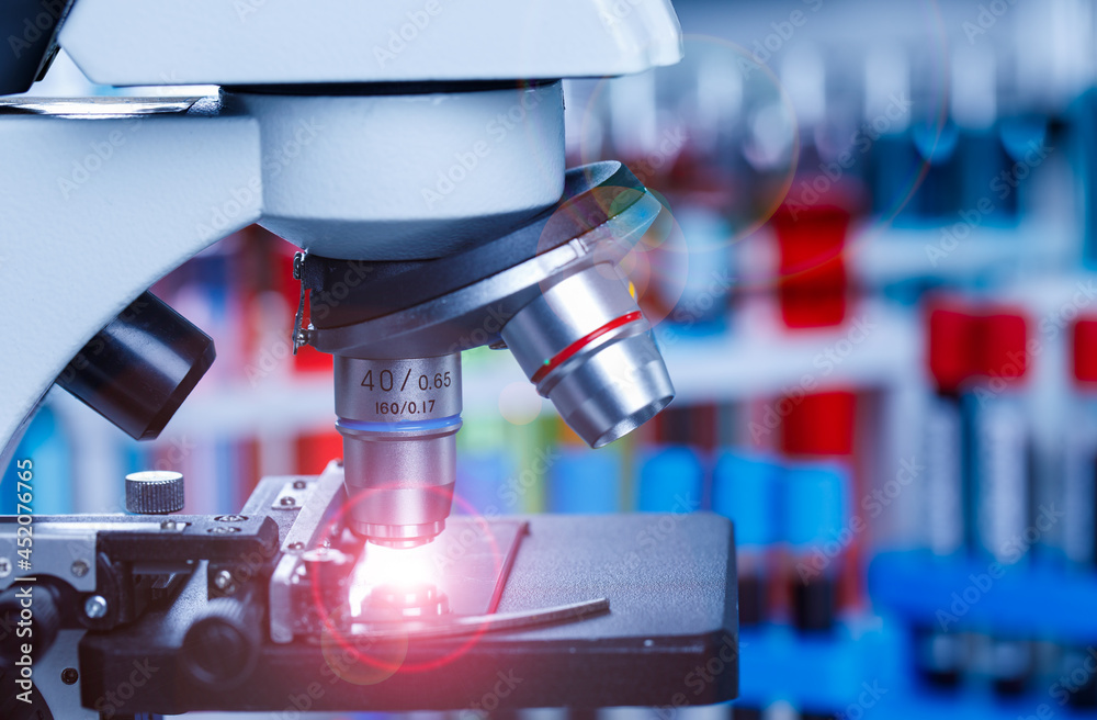 Close up shot of scientific microscope magnifying lens zooming ...