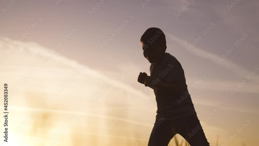 silhouette child kid boxer. boy a boxing with shadow exercising at ...