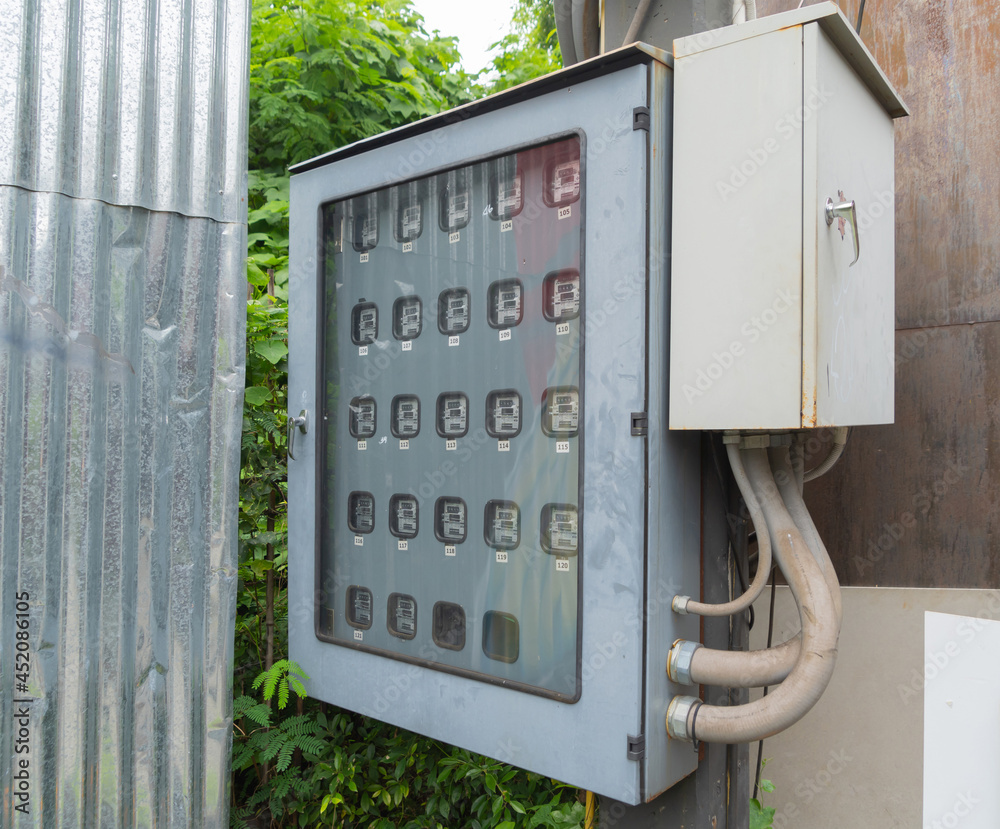 Electrical control meter panel board with number showing. Power plug of ...