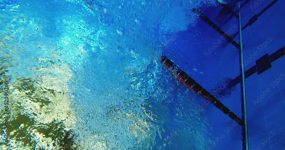 Under water view of professional female swimmer . Underwater footage of ...