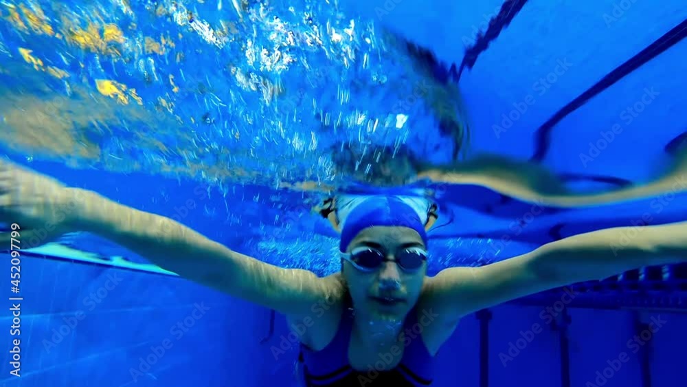 Under water view of professional female swimmer . Underwater footage of ...